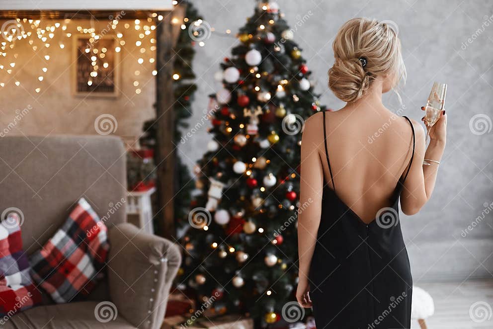 Beautiful And Blonde Model Girl With Perfect Body In The Black Dress