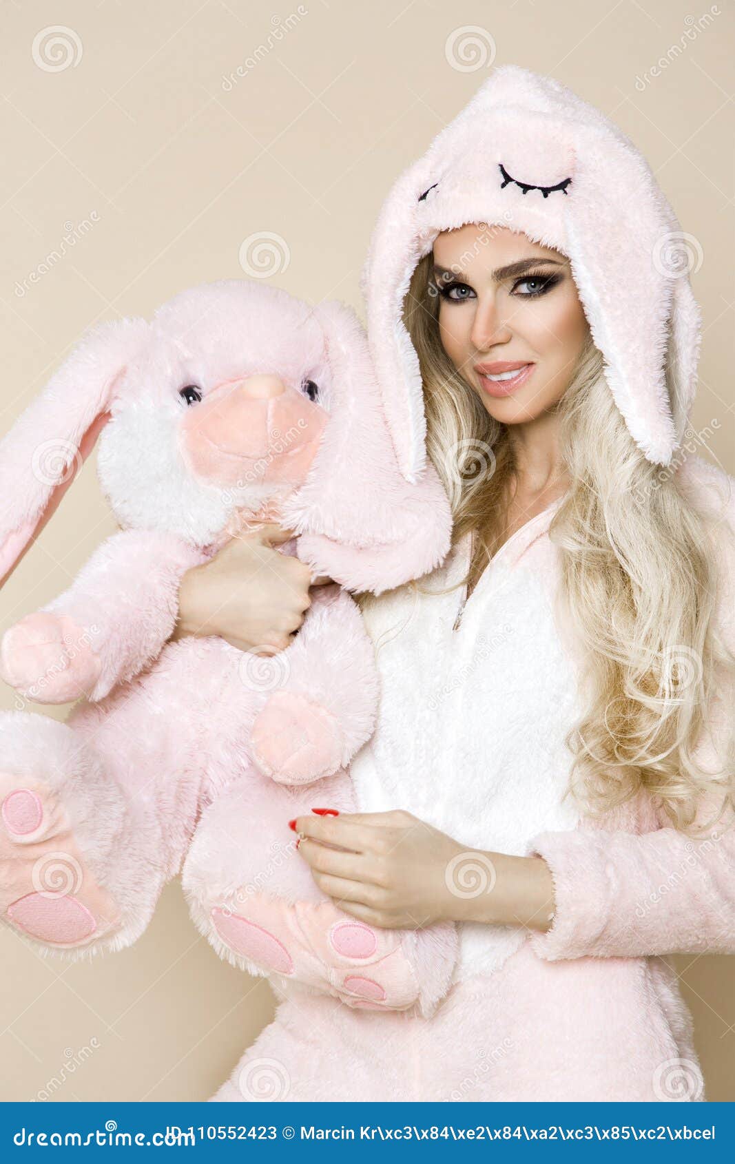 Beautiful Blonde Woman Wearing A Pajama A Bunny Costume Smiling
