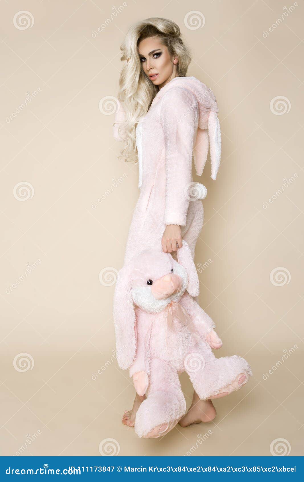 Beautiful Blonde Woman Wearing A Pajama A Bunny Costume Smiling