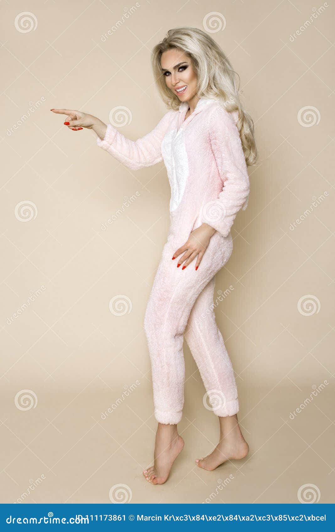 Beautiful Blonde Woman Wearing A Pajama A Bunny Costume Smiling