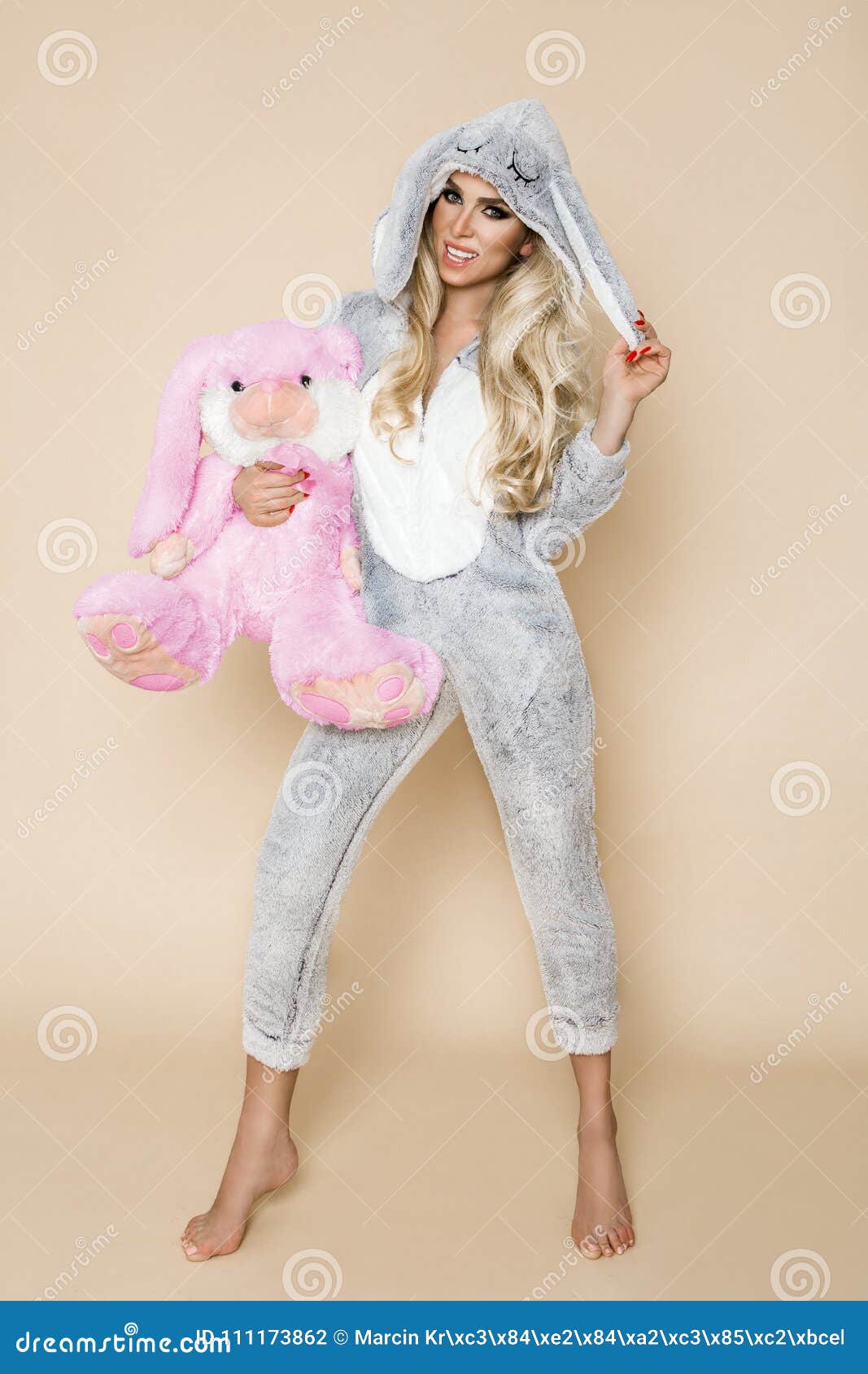 Beautiful Blonde Woman Wearing A Pajama A Bunny Costume Smiling