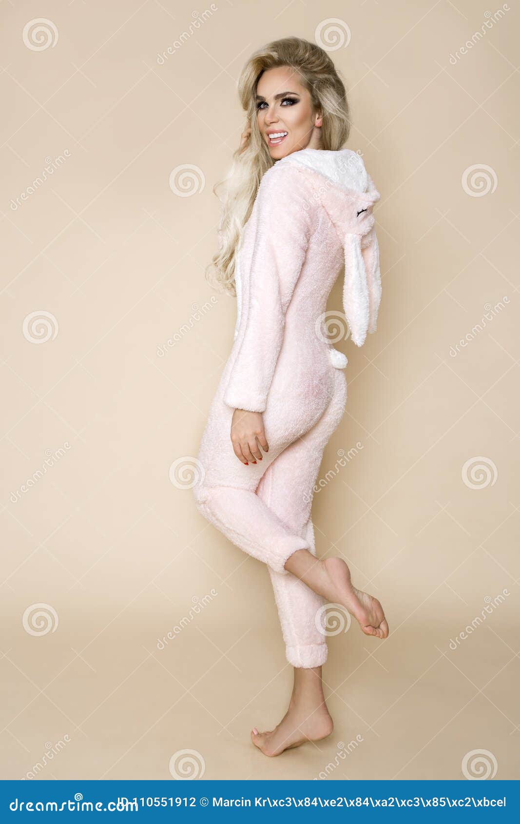 Beautiful Blonde Woman Wearing A Pajama A Bunny Costume Smiling
