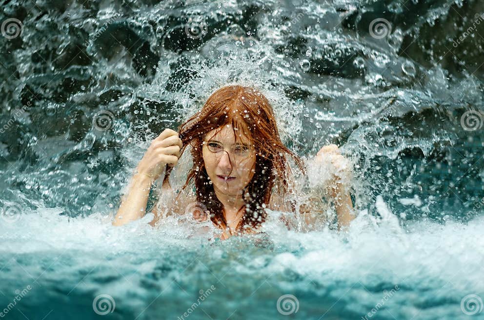 Beautiful Redhead Woman In Bikini Under The Splashing Water Shower Of