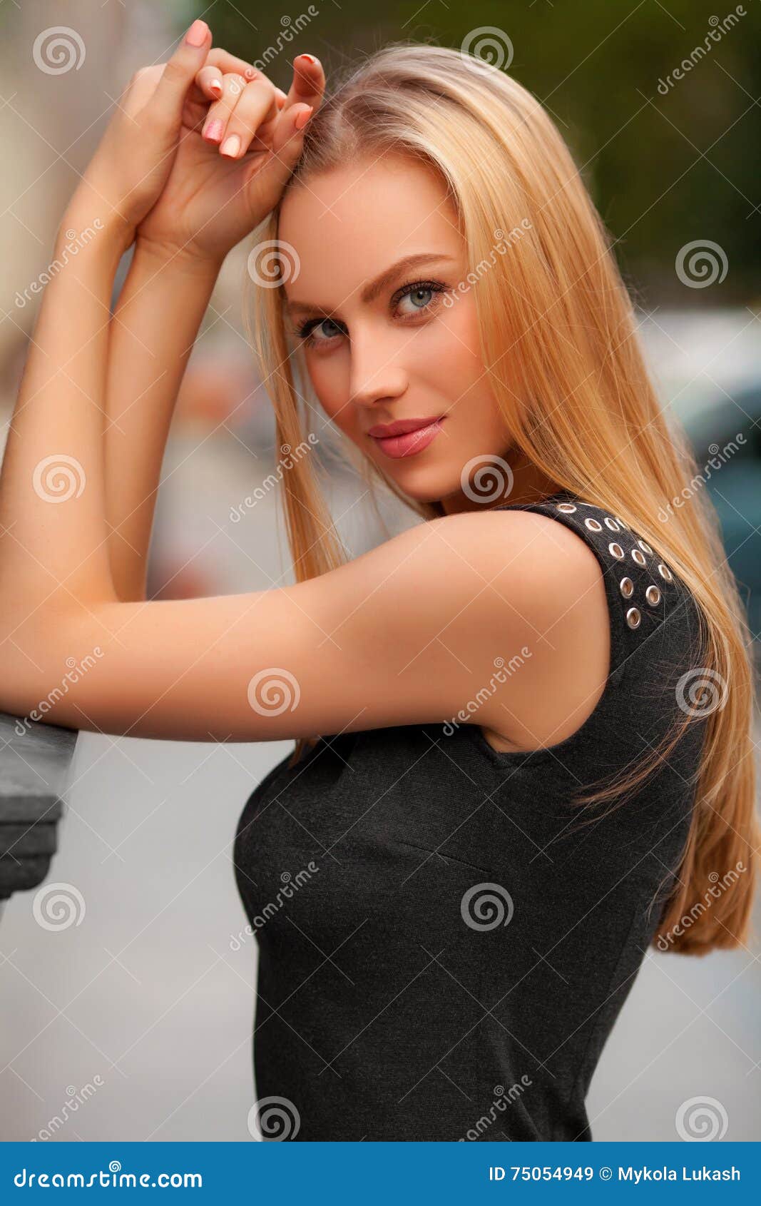 Beautiful Woman With Black Dress And Blond Hair Posing Outdoor Fashion