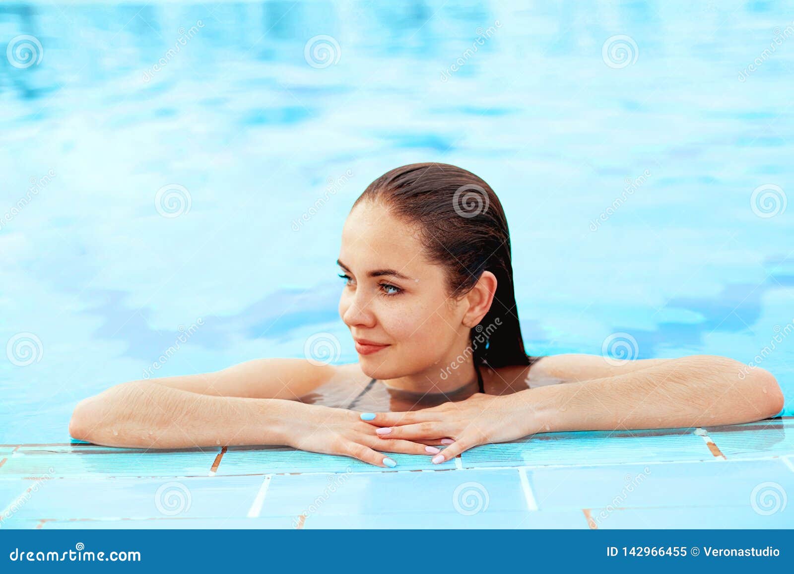 Beautiful Woman Relaxing At Luxury Resort In Swimming Pool Water Stock