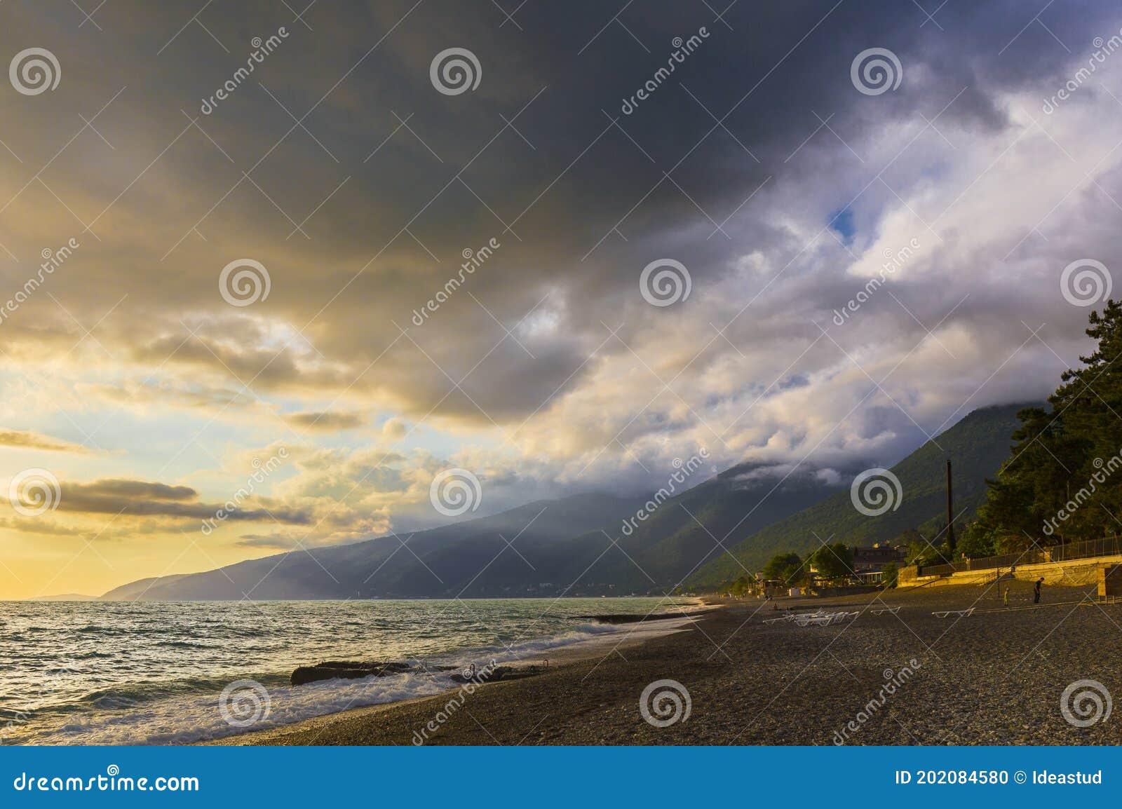 Beautiful Shoreline Scene with Waves at Sunset Beams Stock Photo ...
