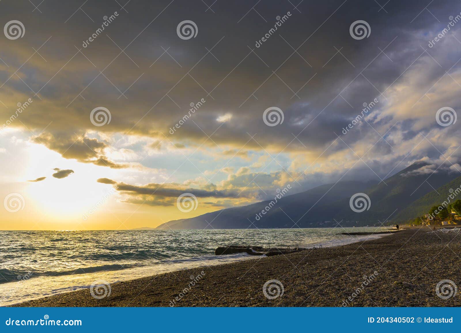 Beautiful Shoreline Scene with Waves at Sunset Beams Stock Photo ...