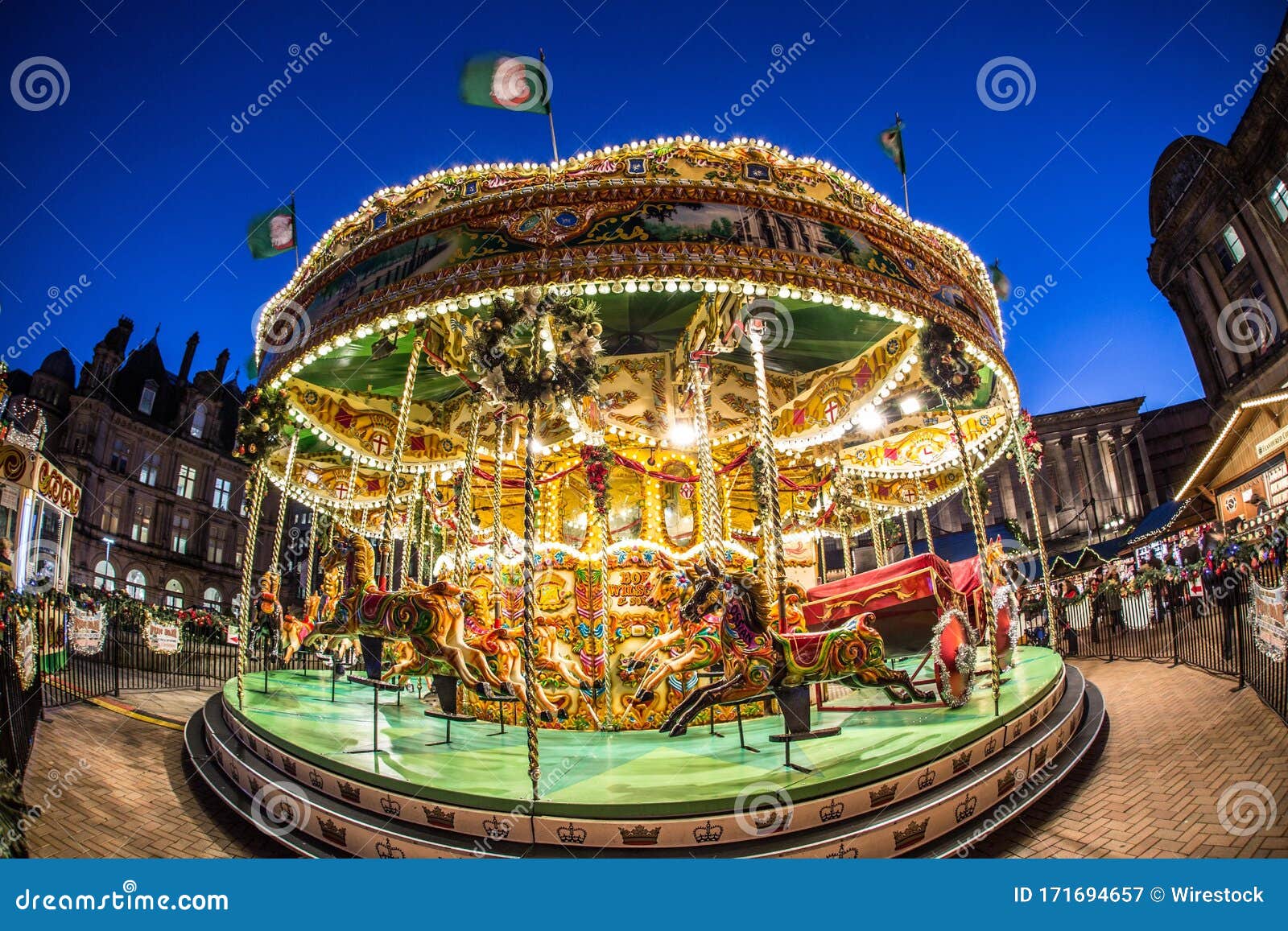 Beautiful Shot of a Child Carousel Surrounded by Buildings in the ...