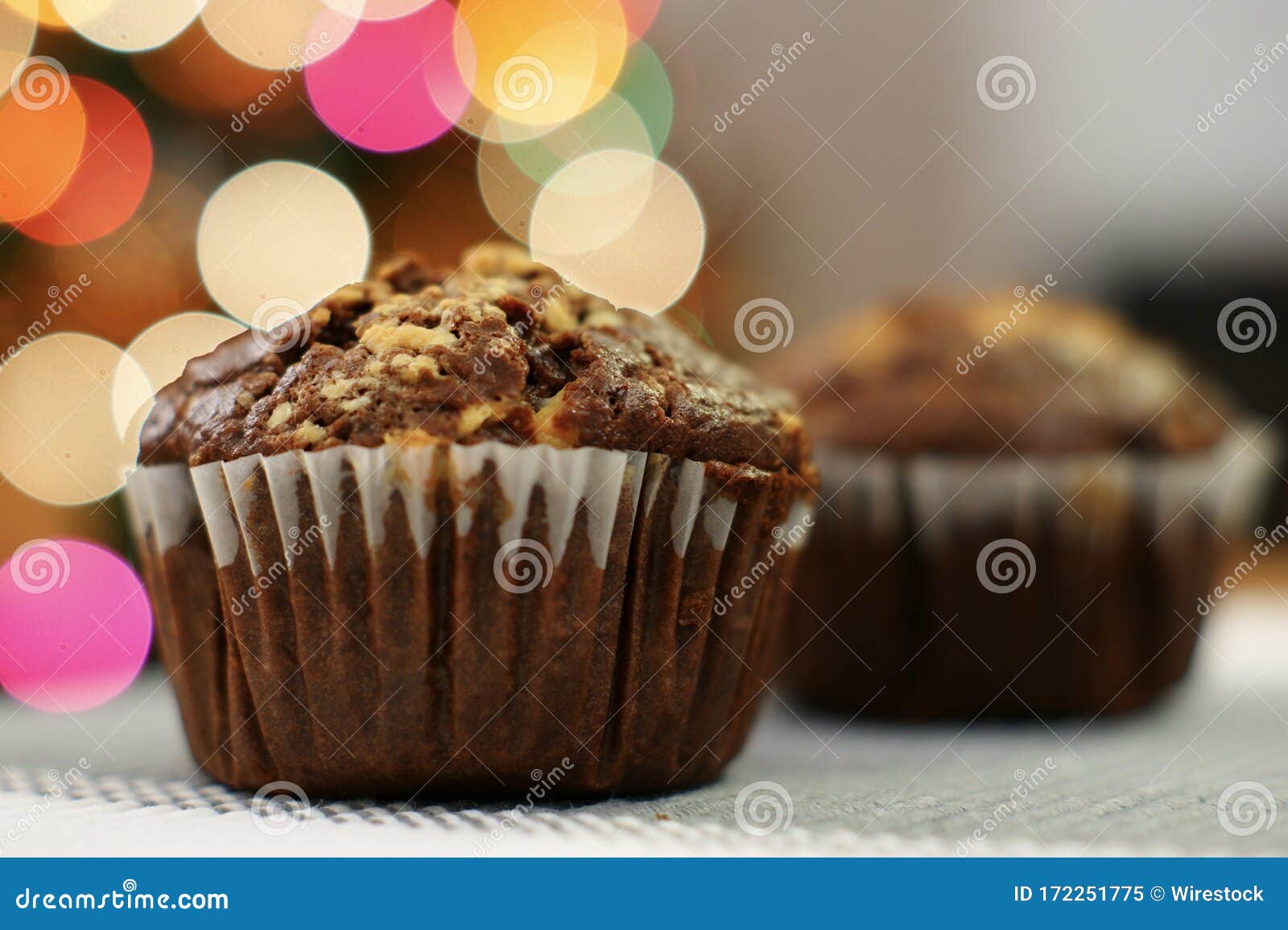 Beautiful Shot of a Chocolate Muffin with Blurred Lights in the ...