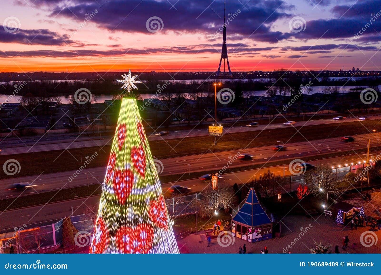 Beautiful Shot of a Christmas Tree in an Amusement Park at Sunset Stock ...