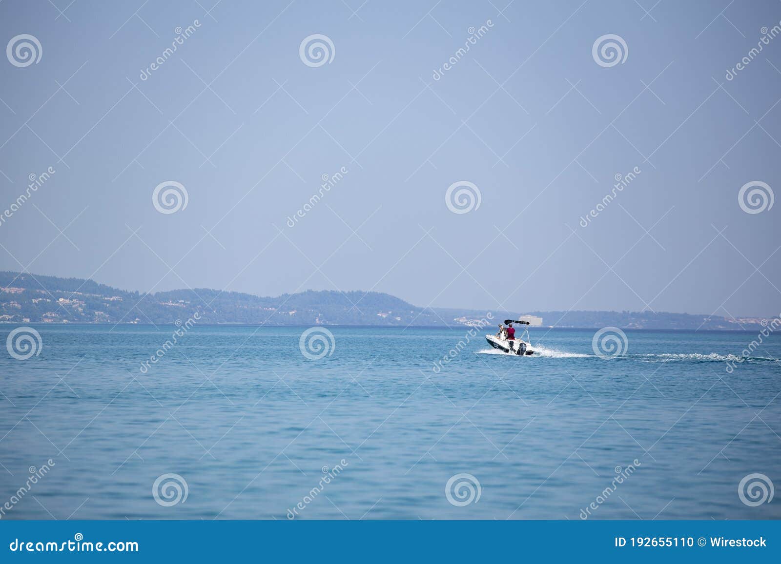 Beautiful Shot of a Fast-moving Speed Boat with a Clear Sky Background ...