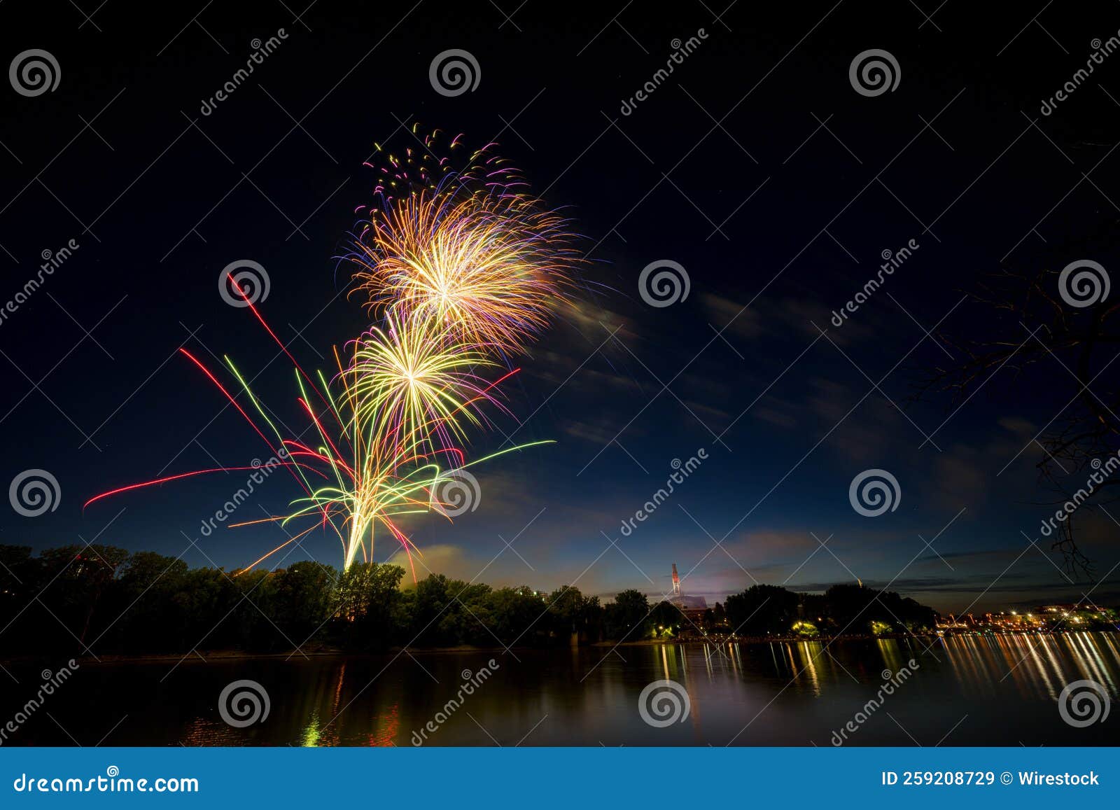 Beautiful Shot of Glowing Exploding Fireworks in a Night Sky Over a ...