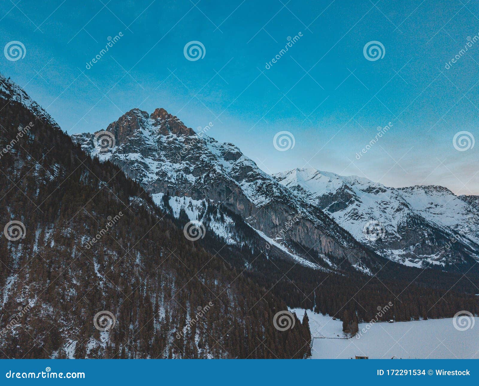 Beautiful Shot of a Mountain Range in a Cold and Snowy Day Stock Photo ...