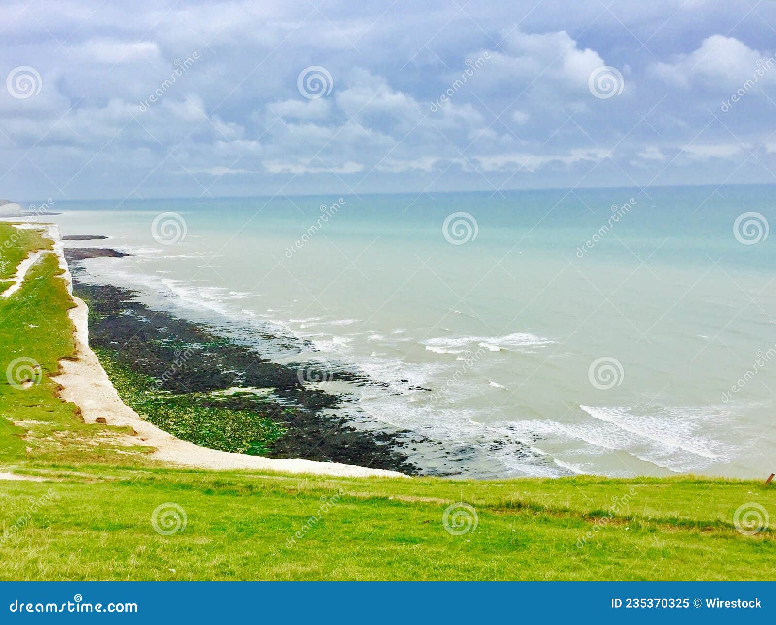 Beautiful Shot of a Sea with Greenery in the Foreground Stock Image ...
