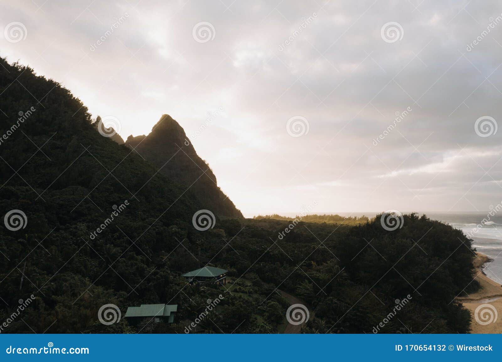 Beautiful Shot of a Steep Mountain with the Light of the Sunset in the ...