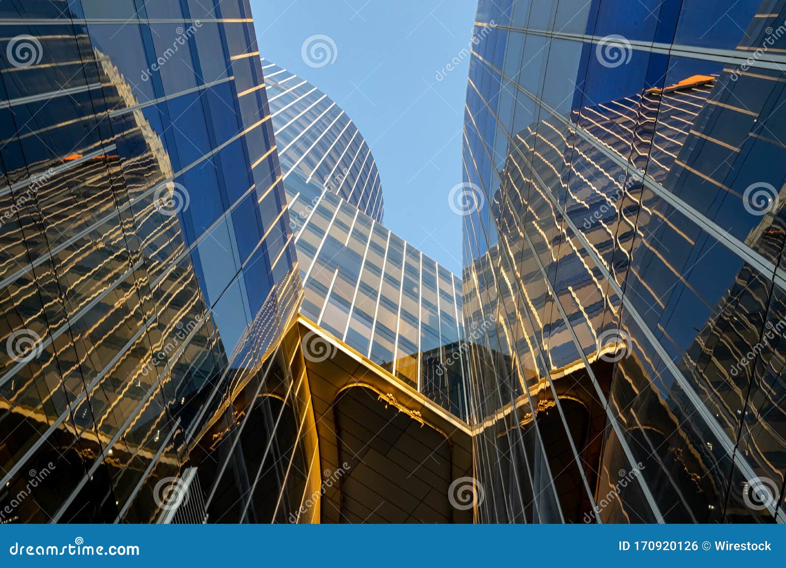 Beautiful Shot of Two Building Connected with a Bridge and Reflecting ...
