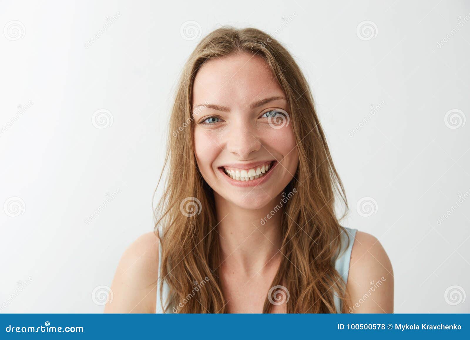 Beautiful Sincere Happy Girl Smiling Laughing Looking At Camera Over White Background Stock