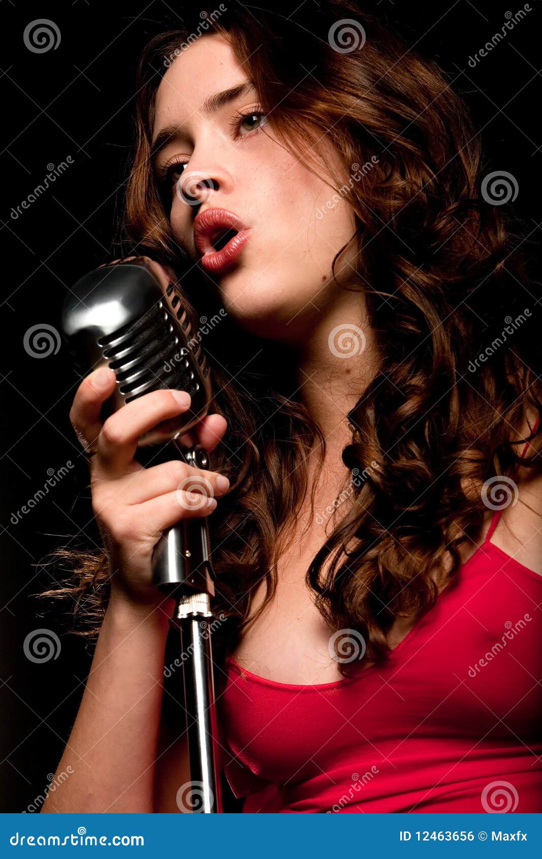 Beautiful Singer Singing with Microphone Stock Photo - Image of ...