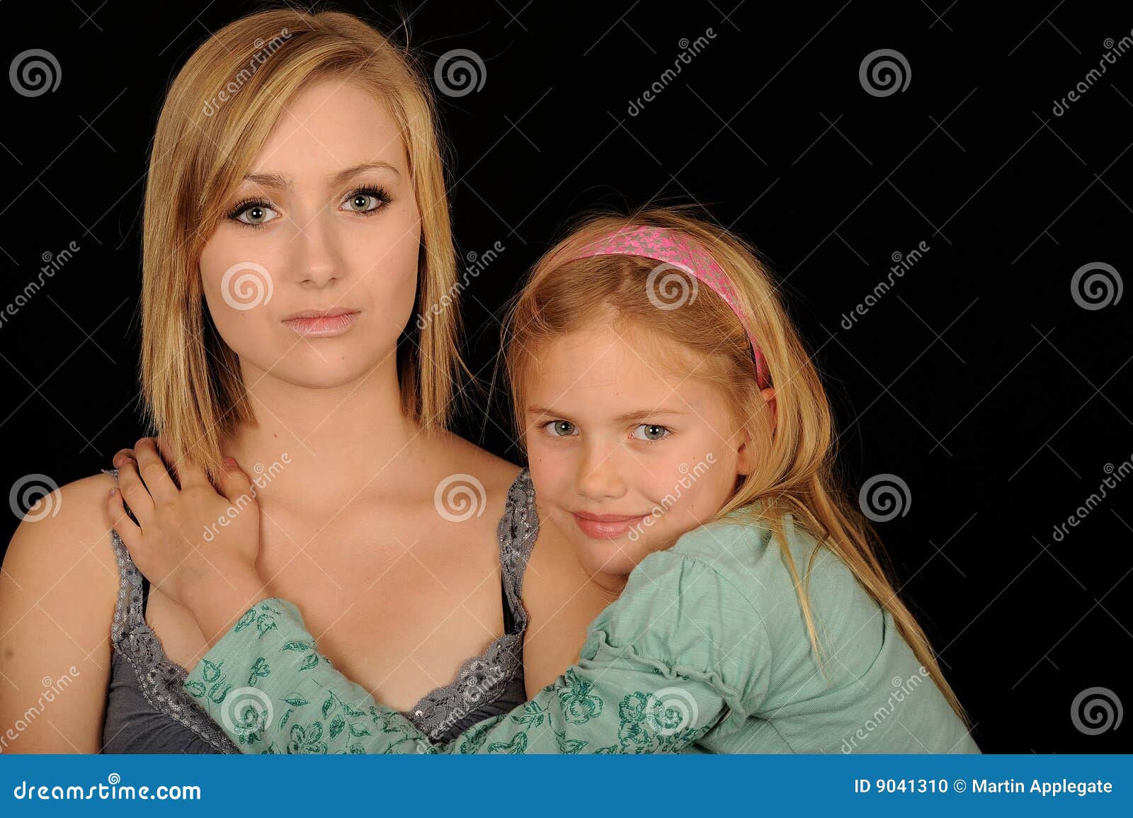 Two Beautiful Sisters Hugging Isolated Royalty-Free Stock Photo ...