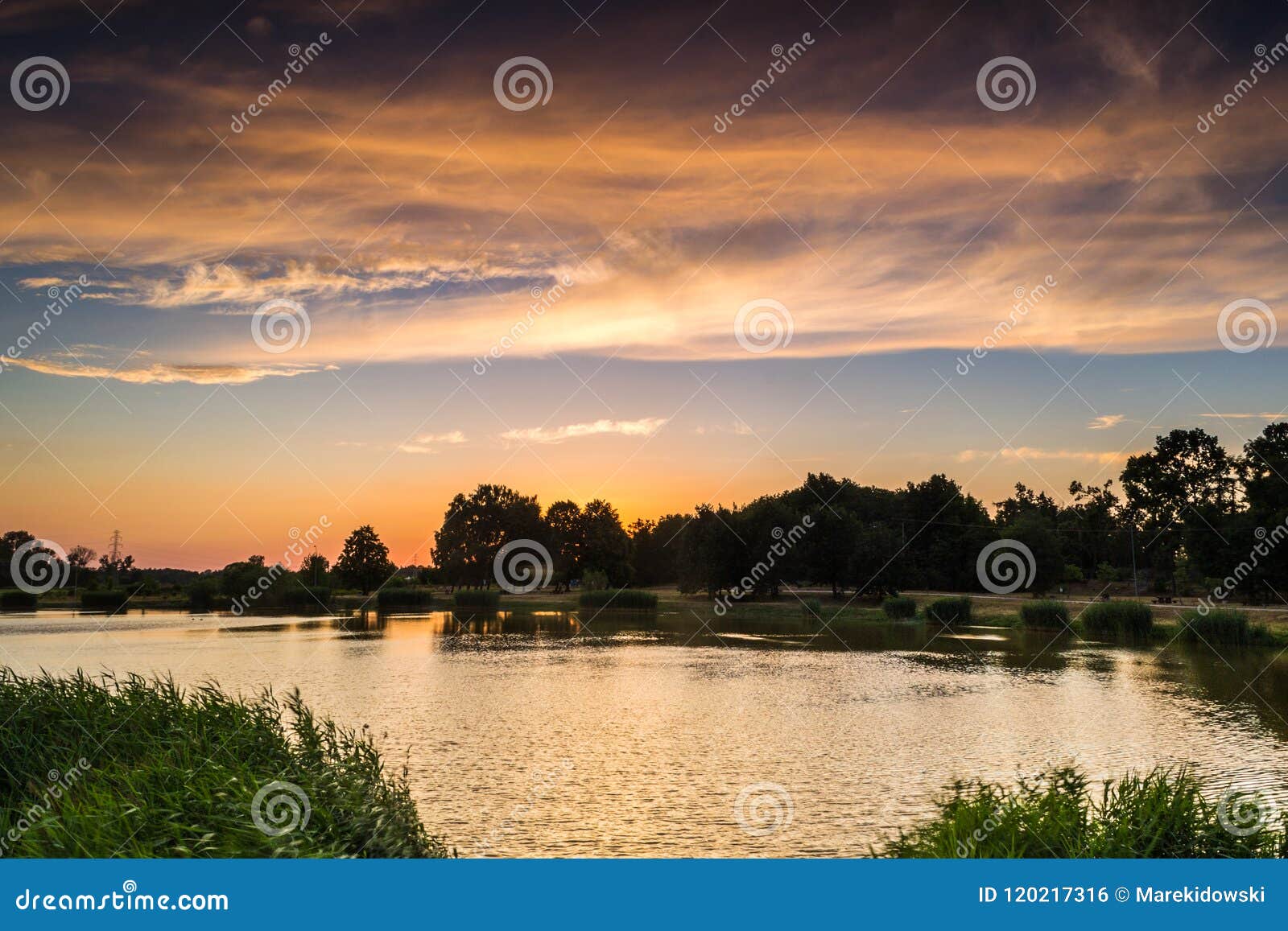 Sunset at the pond stock photo. Image of sunset, orange - 120217316