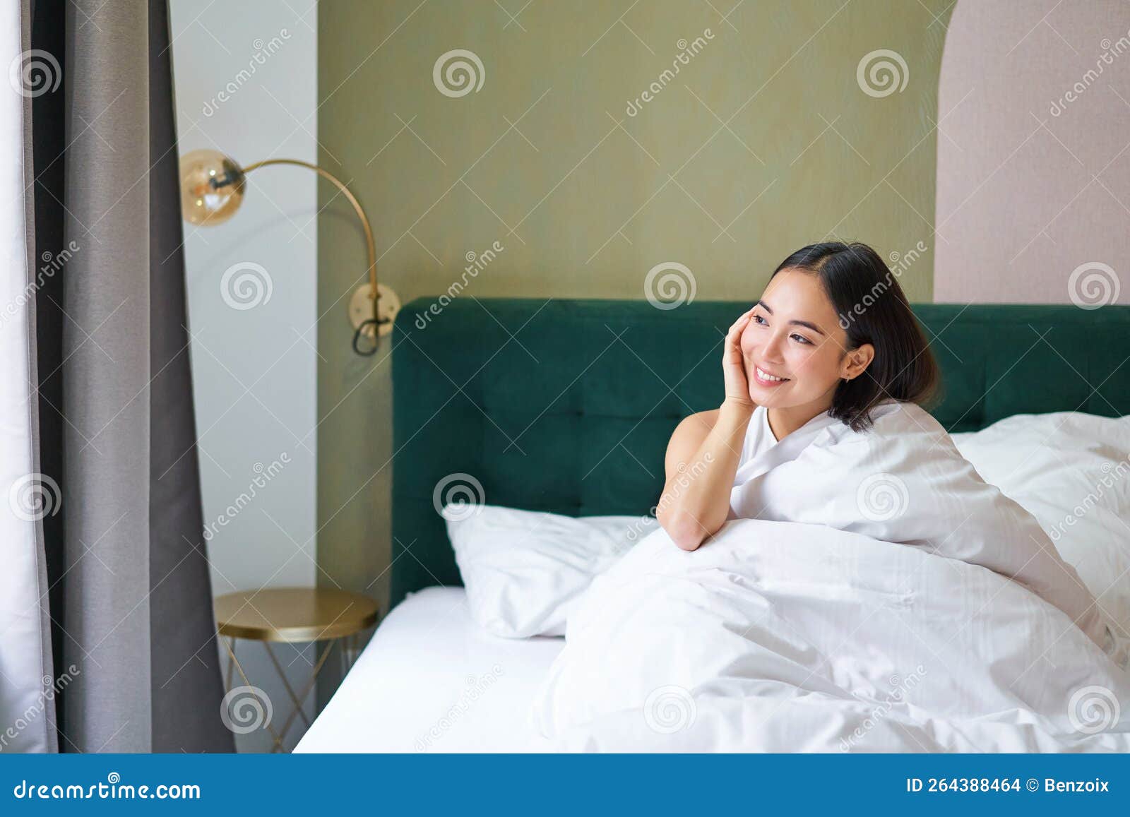 Beautiful Sleepy Asian Girl Wakes Up In Her Bed With Cozy White