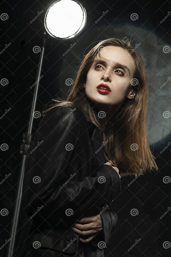 Beautiful Slim Girl Model With Red Lips Wearing A Black Blazer