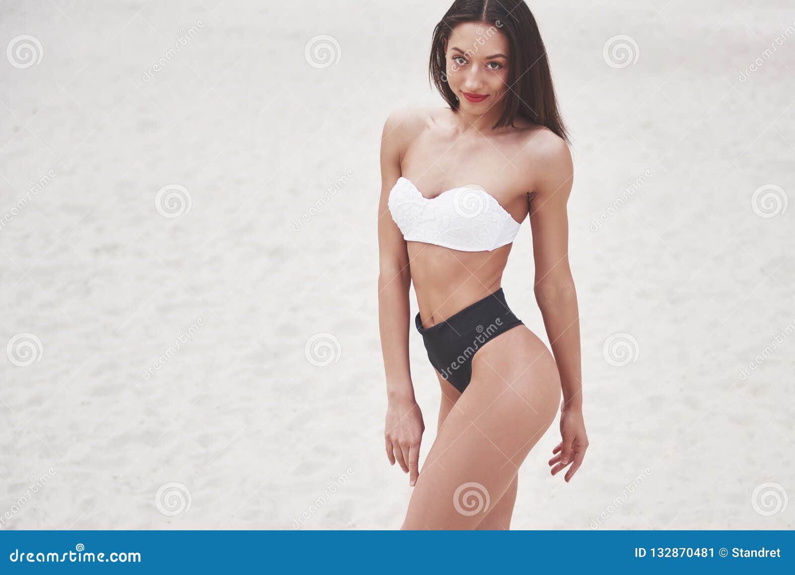 Beautiful Slim Luxury Girl In Bikini On The Sand Beach On A Tropical Island Tanned Body And
