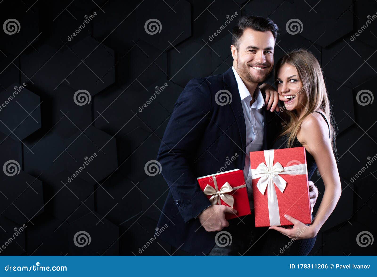 Beautiful Smiling Couple with Presents Stock Photo - Image of giving ...