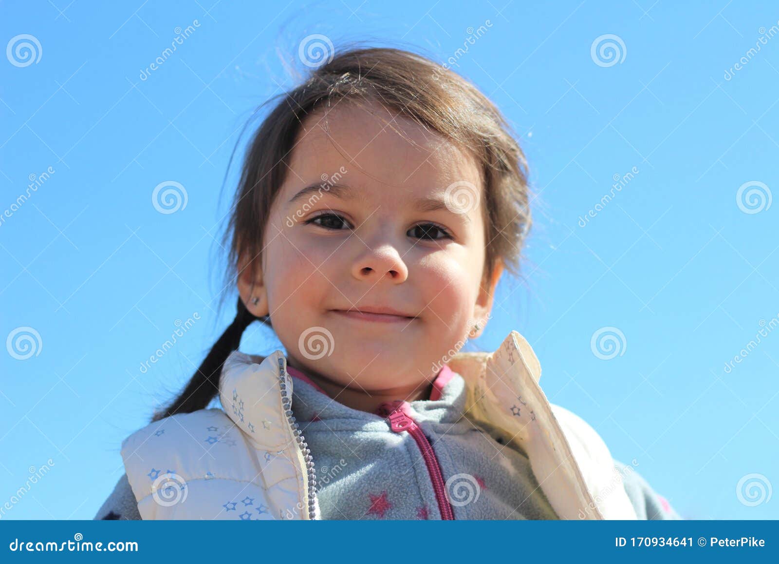 Beautiful Smiling Girl on a Background of Blue Sky Stock Image - Image ...