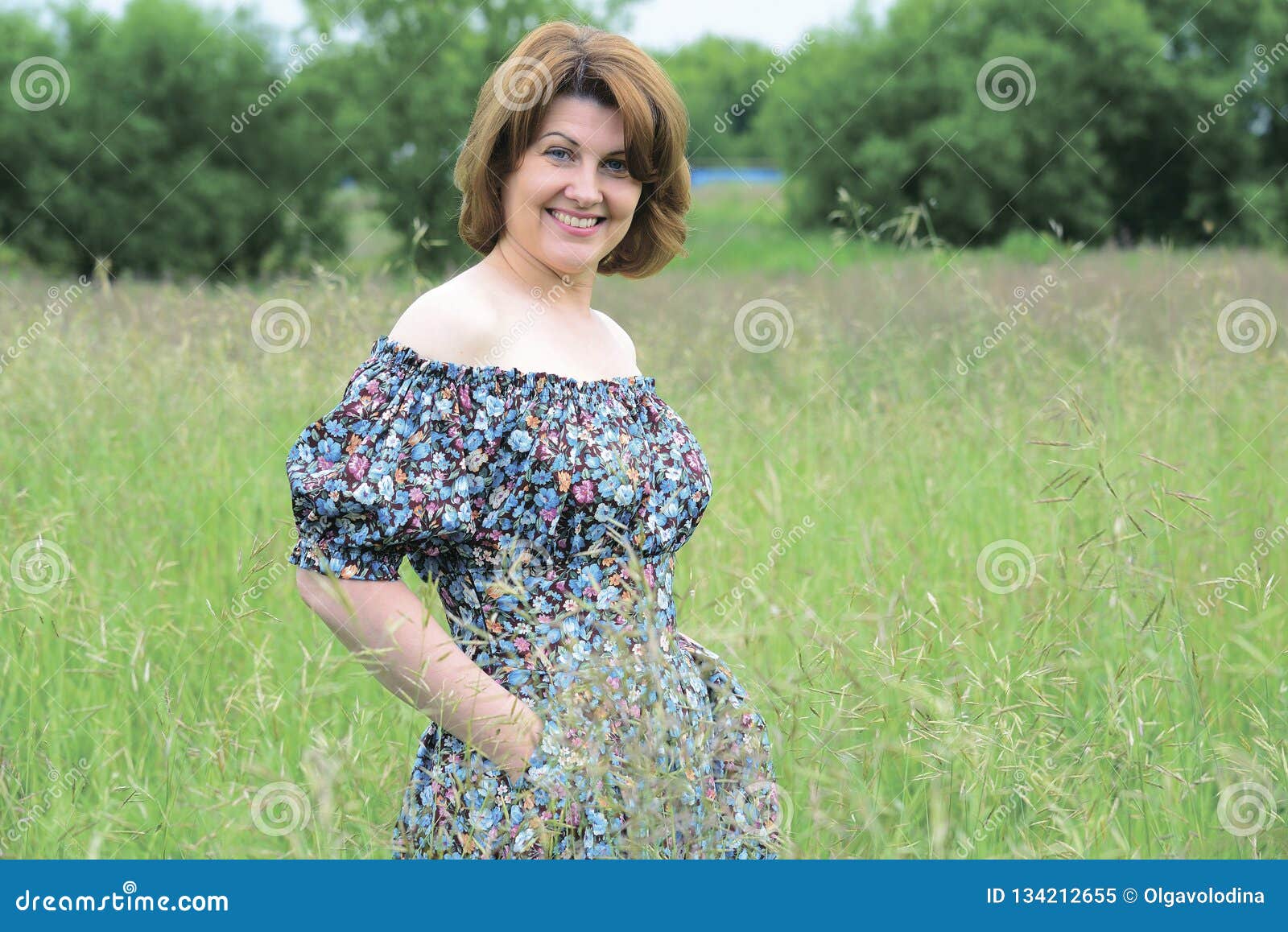 Beautiful Smiling Middle-aged Woman in Nature in Summer Stock Image ... Beautiful Smiling Middle-aged Woman in Nature in Summer Stock Image ...