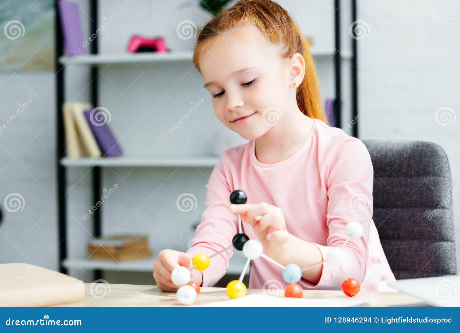 Beautiful Smiling Redhead Schoolgirl Studying with Molecular Model ...