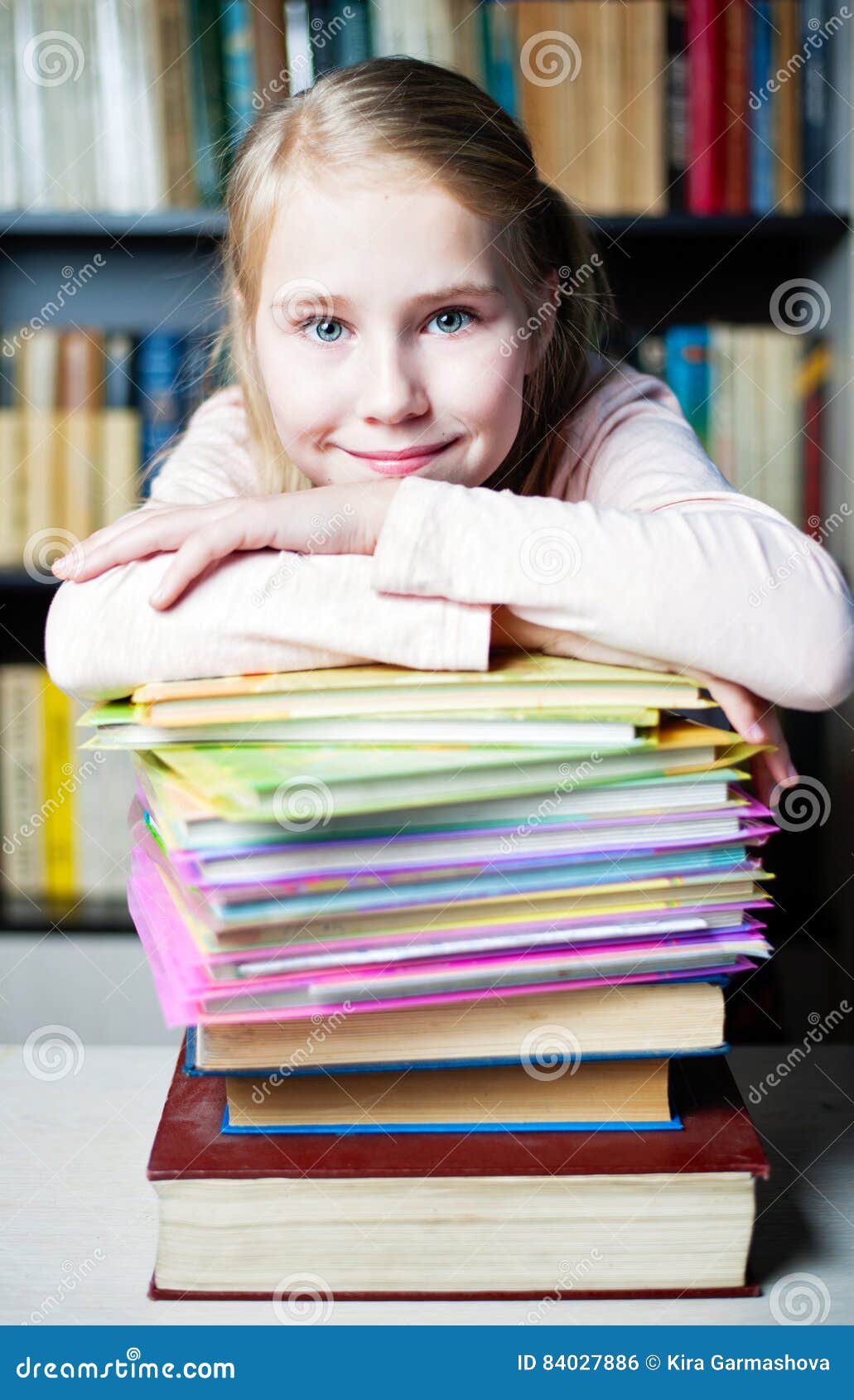 Beautiful Smiling Student with Pile of Books Stock Photo - Image of ...