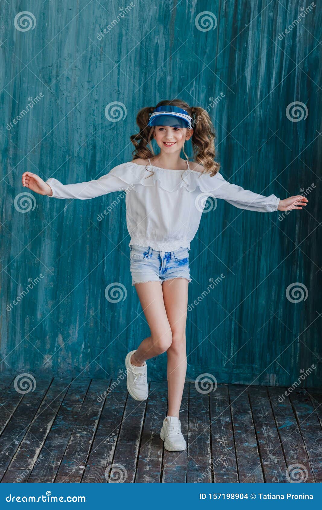 Beautiful Smiling Teen Girl Happily Dance in Blue Studio Stock Photo ... Beautiful Smiling Teen Girl Happily Dance in Blue Studio Stock Photo ...
