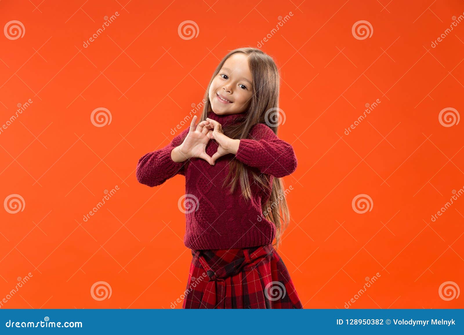 Beautiful Smiling Teen Girl Makes the Shape of a Heart with Her Hands ... Beautiful Smiling Teen Girl Makes the Shape of a Heart with Her Hands ...