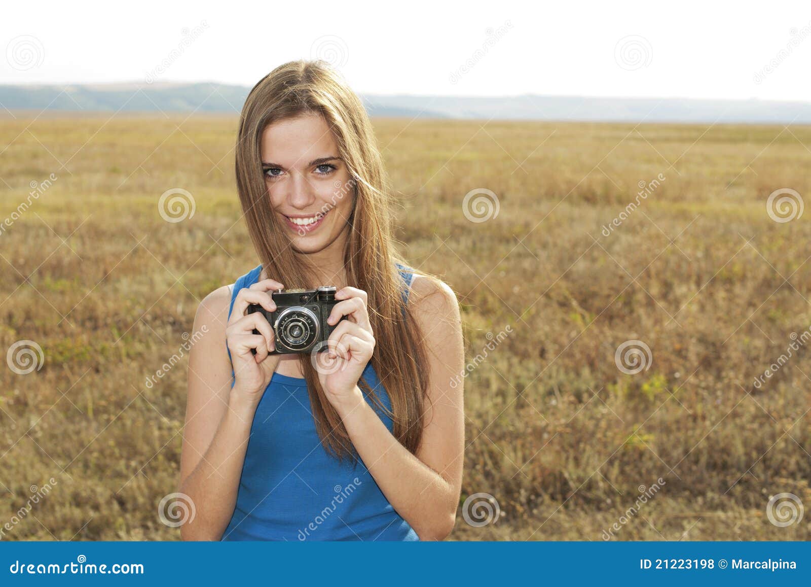 Beautiful Smiling Woman with Camera on Nature Stock Photo - Image of ...
