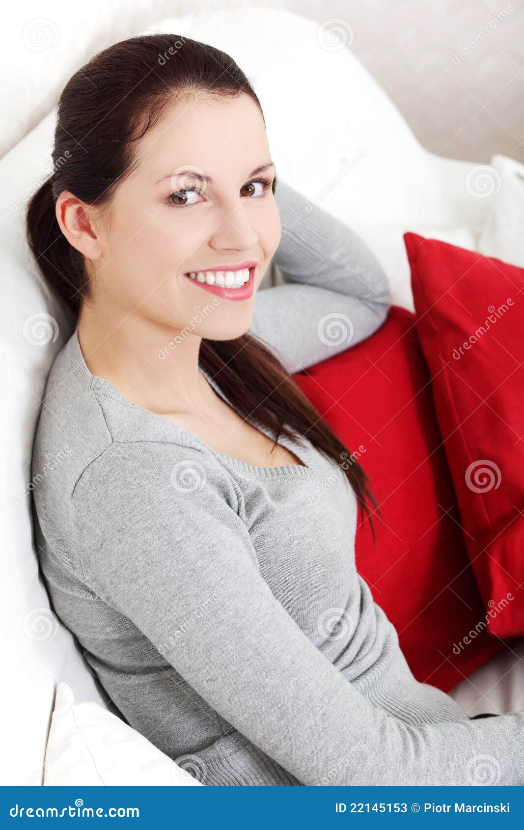 Beautiful Smiling Woman Sitting on a Sofa. Stock Image - Image of ...