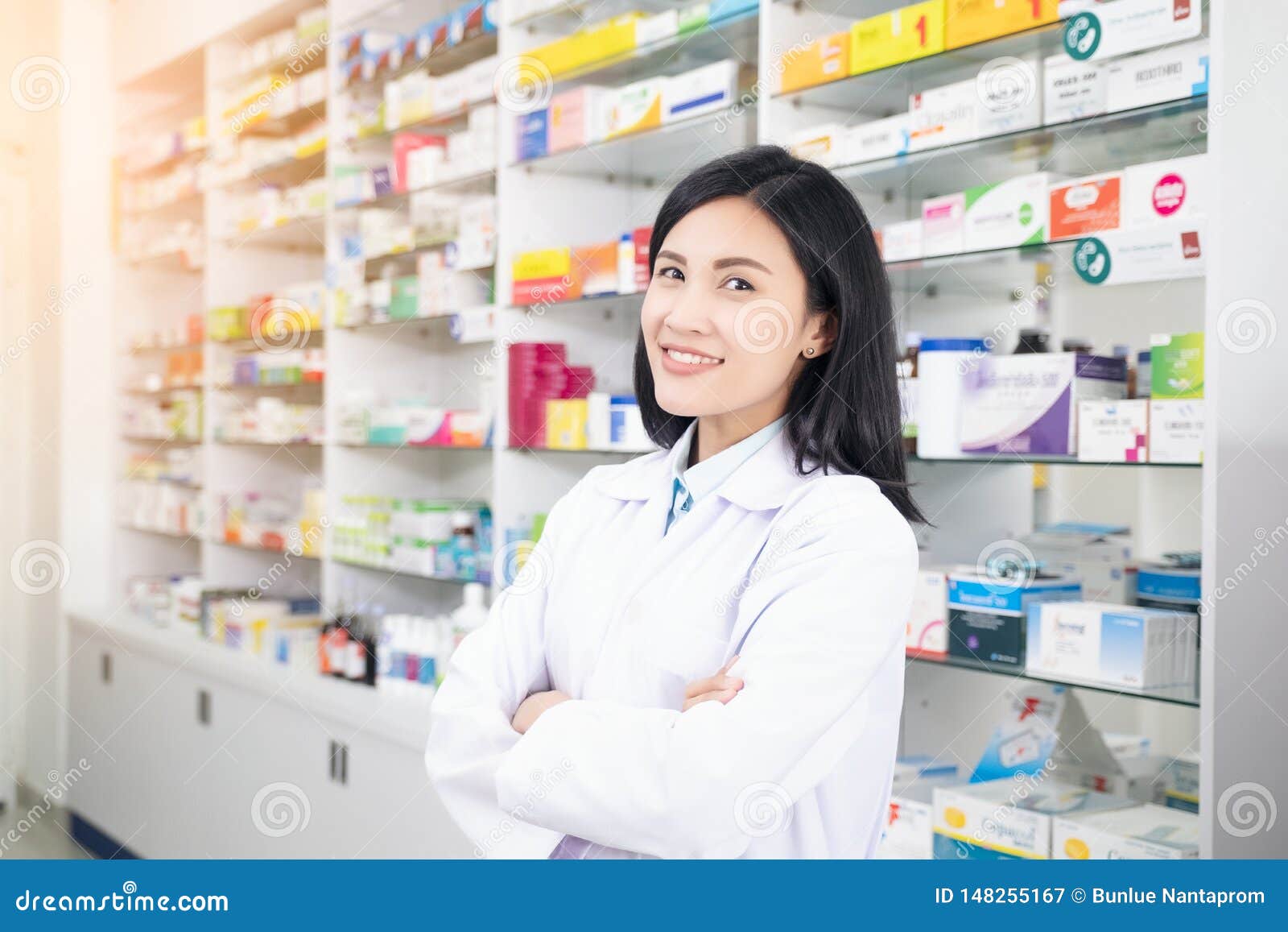 Beautiful Smiling Young Woman Pharmacist Doing His Work in Pharmacy ...