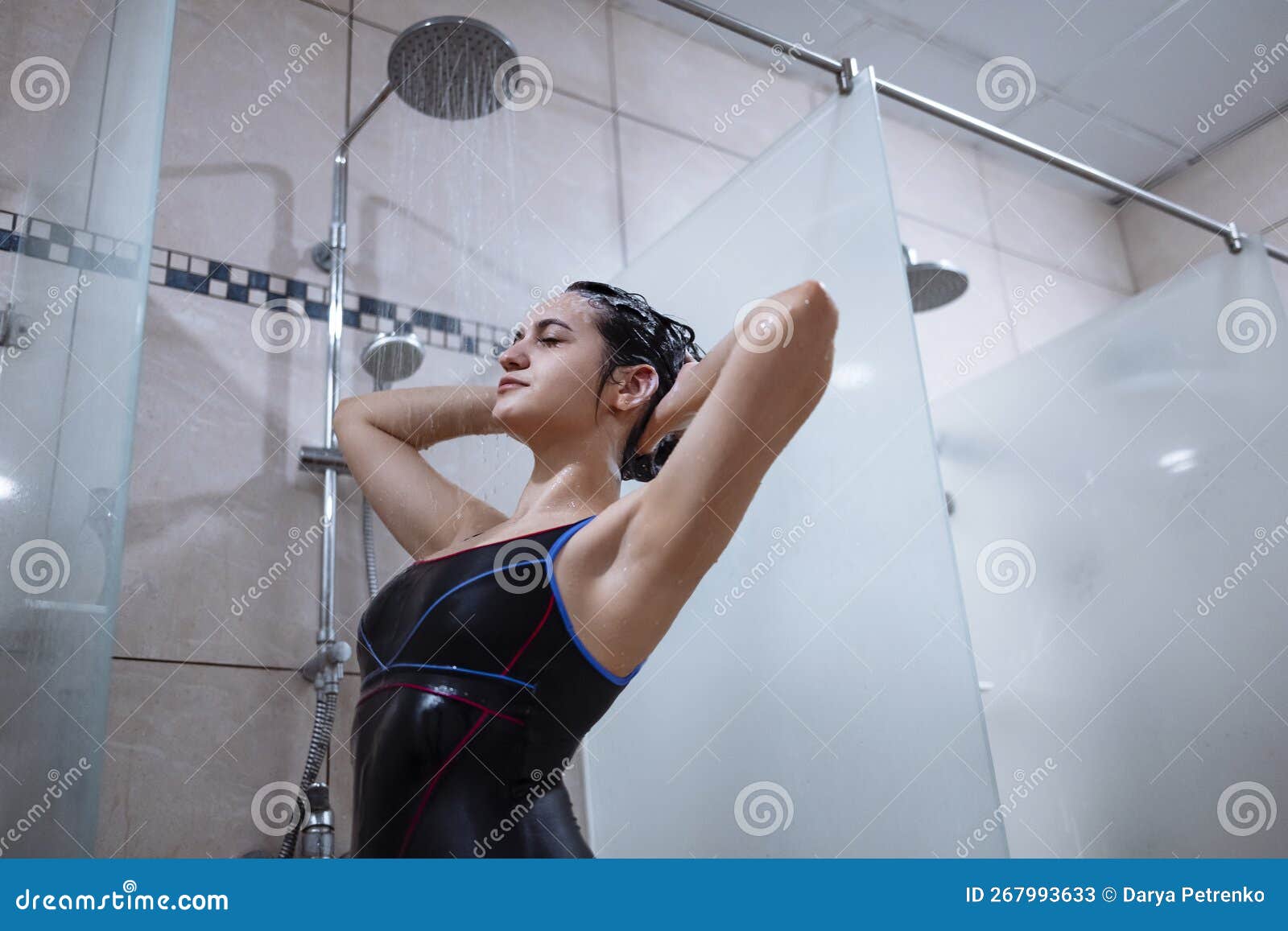 Beautiful Smiling Young Woman Taking A Shower In Gym Stock Image