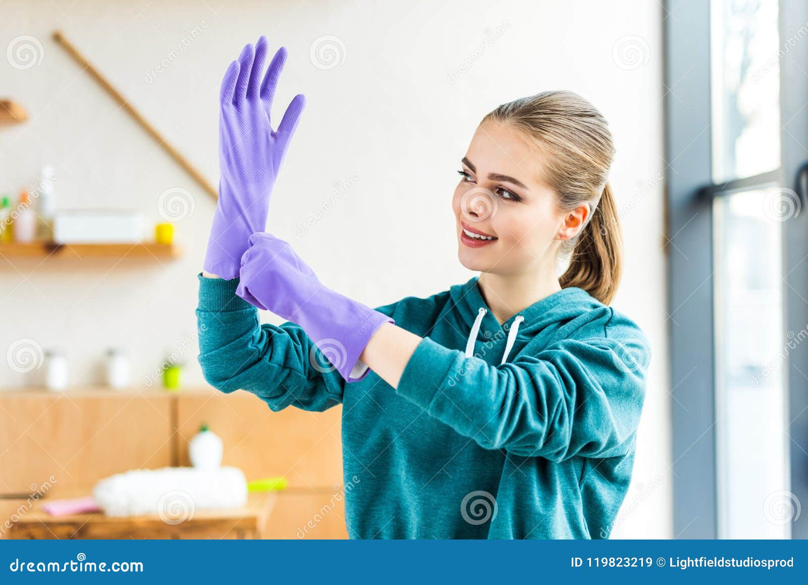 Beautiful Smiling Young Woman Wearing Rubber Gloves while Cleaning ... Beautiful Smiling Young Woman Wearing Rubber Gloves while Cleaning ...