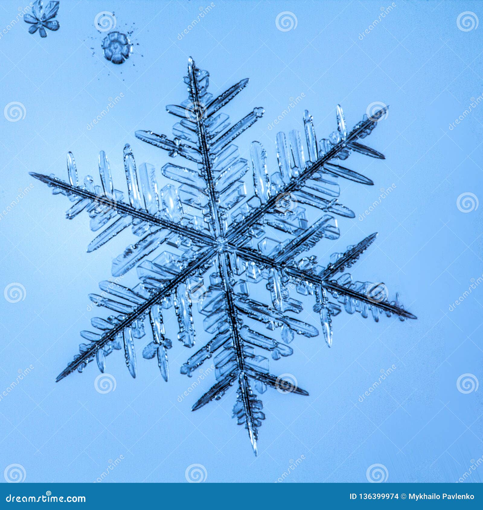 Beautiful Snow Flake on a Light Blue Background Close Up Stock Photo ...