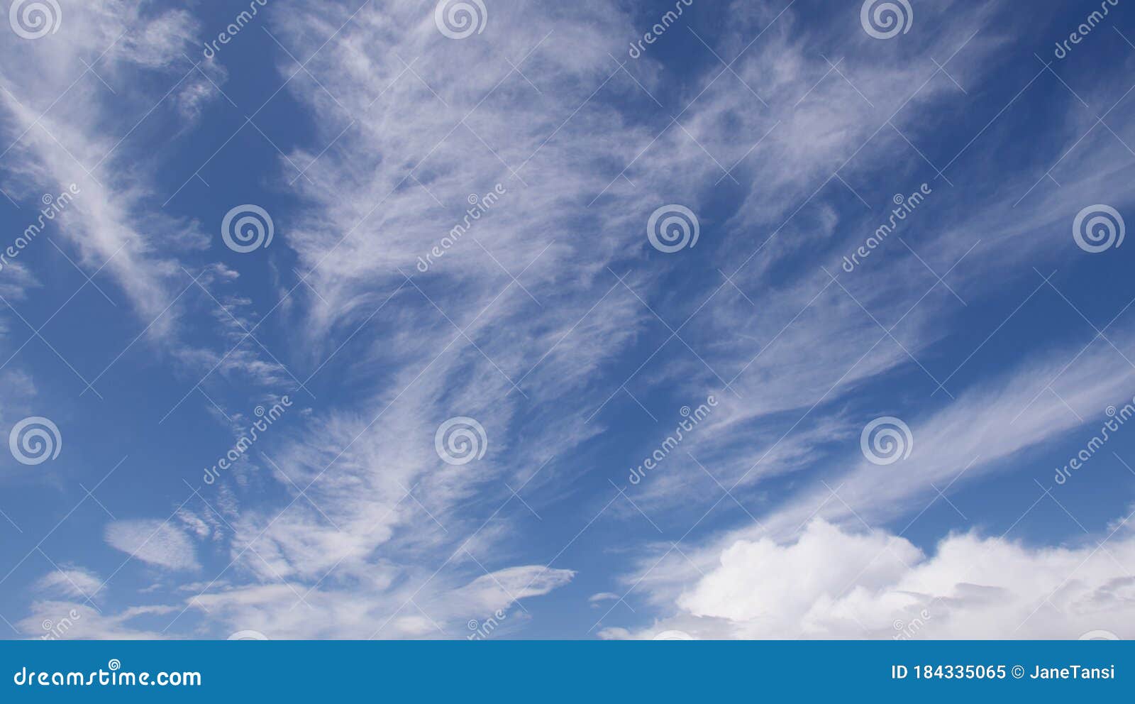 Beautiful Soft Wispy Cloud Formation Against a Deep Blue Sky Stock ...