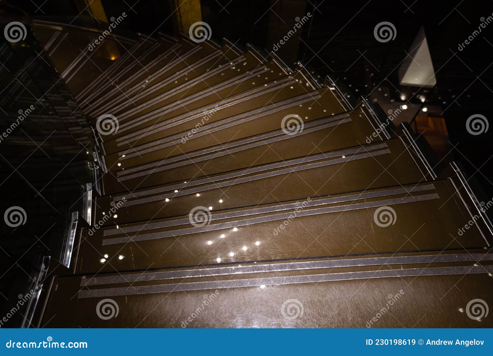 A Beautiful Staircase With Stone Steps And A Metal Lattice Among The ...