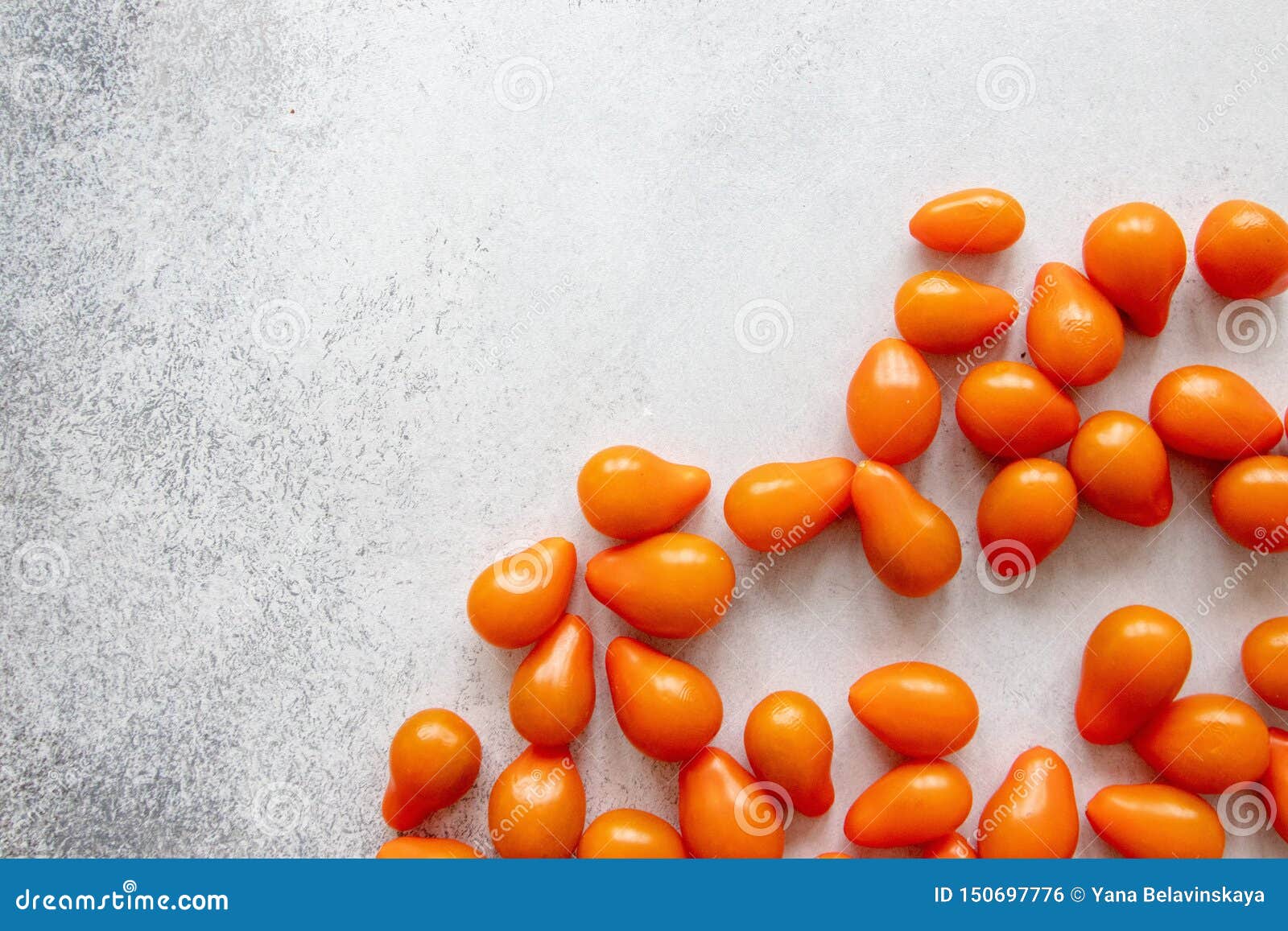 Small Orange Tomatoes on a Grey Table Stock Photo - Image of eating ...