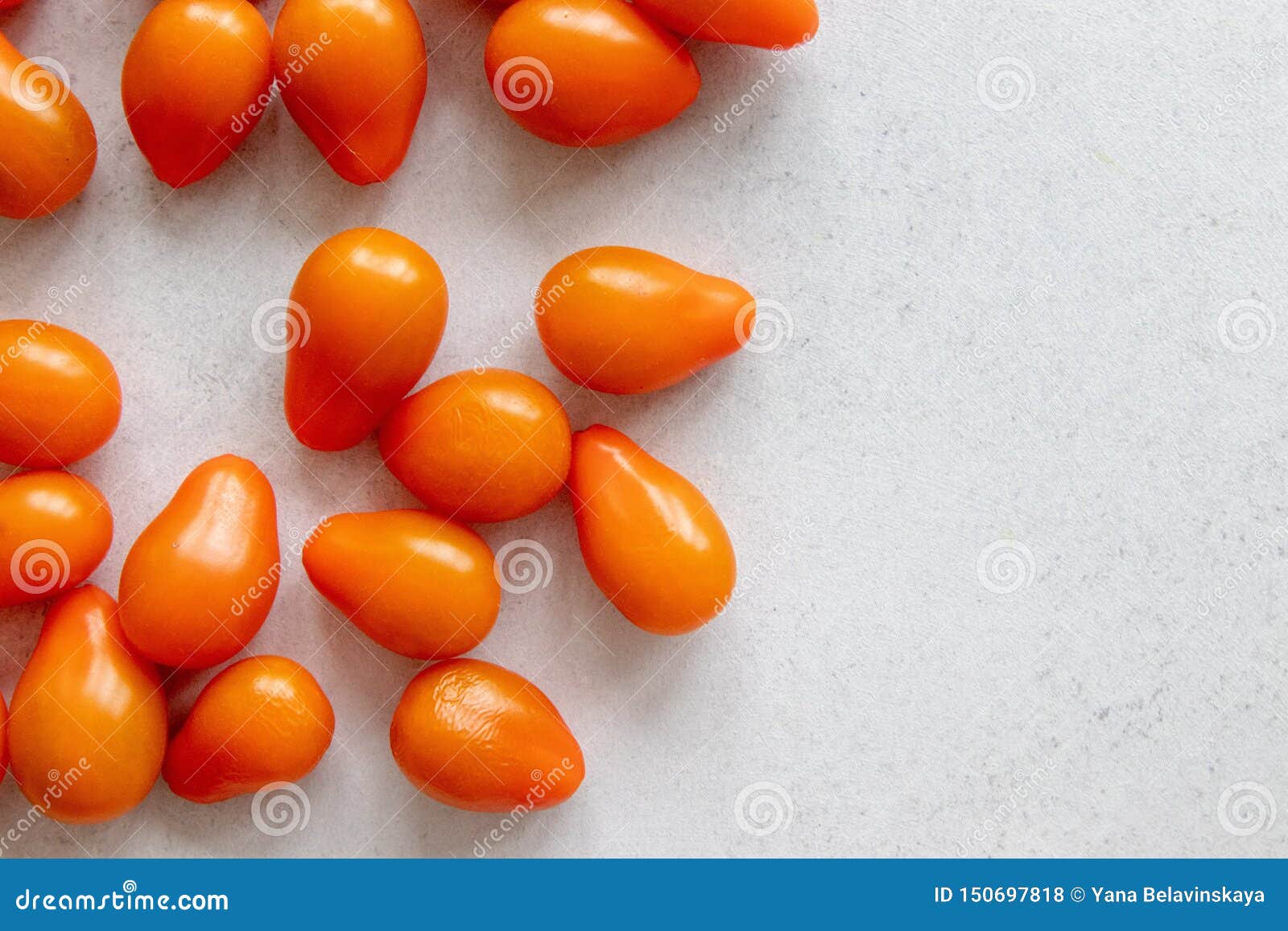 Small Orange Tomatoes on a Grey Table Stock Photo - Image of perfect ...