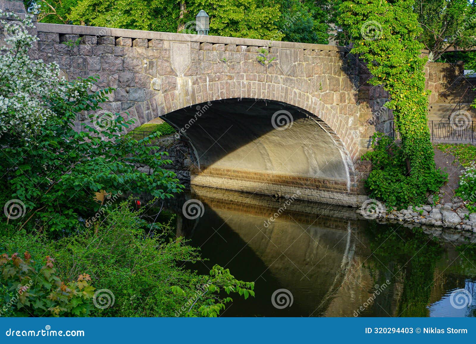 A Beautiful Stone Bridge Over a Canal Stock Image - Image of summer ...