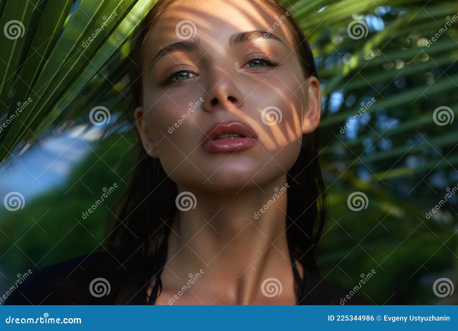 Beautiful Summer Girl In Palm Leaves During Sunset Young Woman In