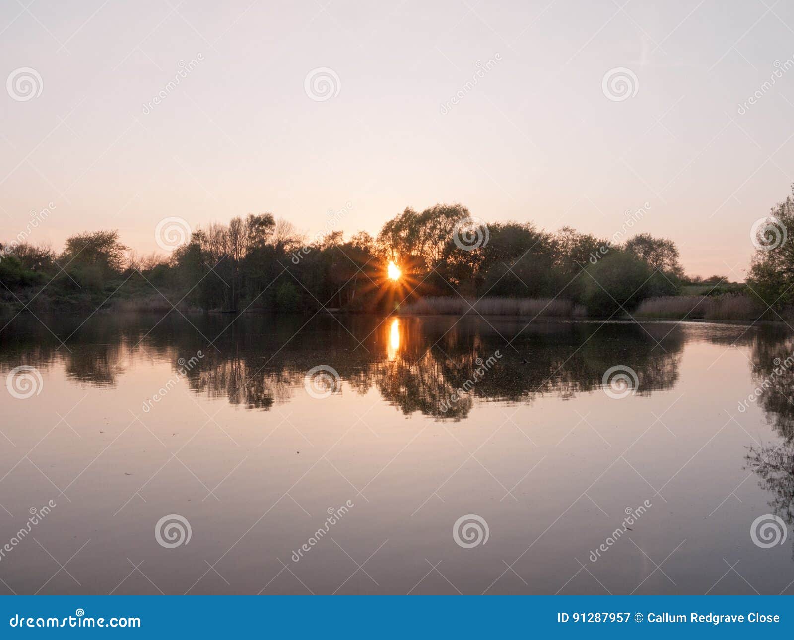 Beautiful Sun Set Over a Lake in Spring with a Sun Globe Stock Image ...