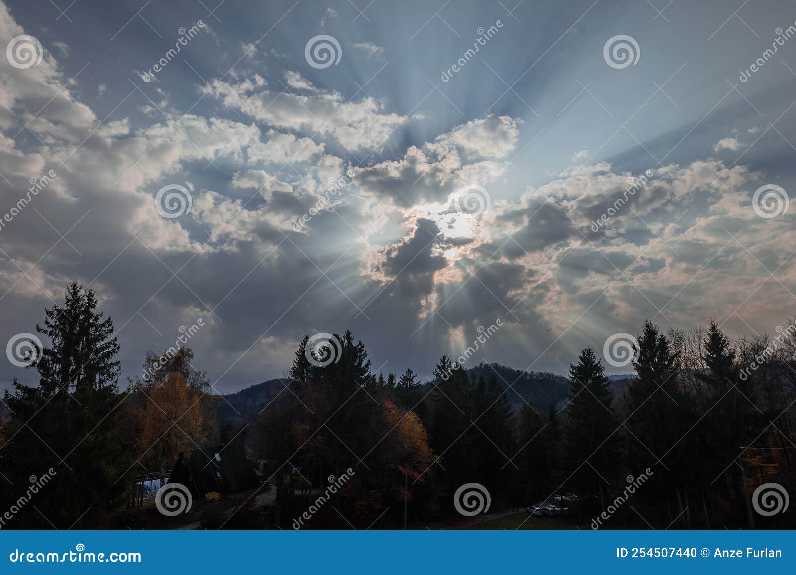 Beautiful Sun Streaks Coming Out from the Heavy Clouds on the Sky Stock ...