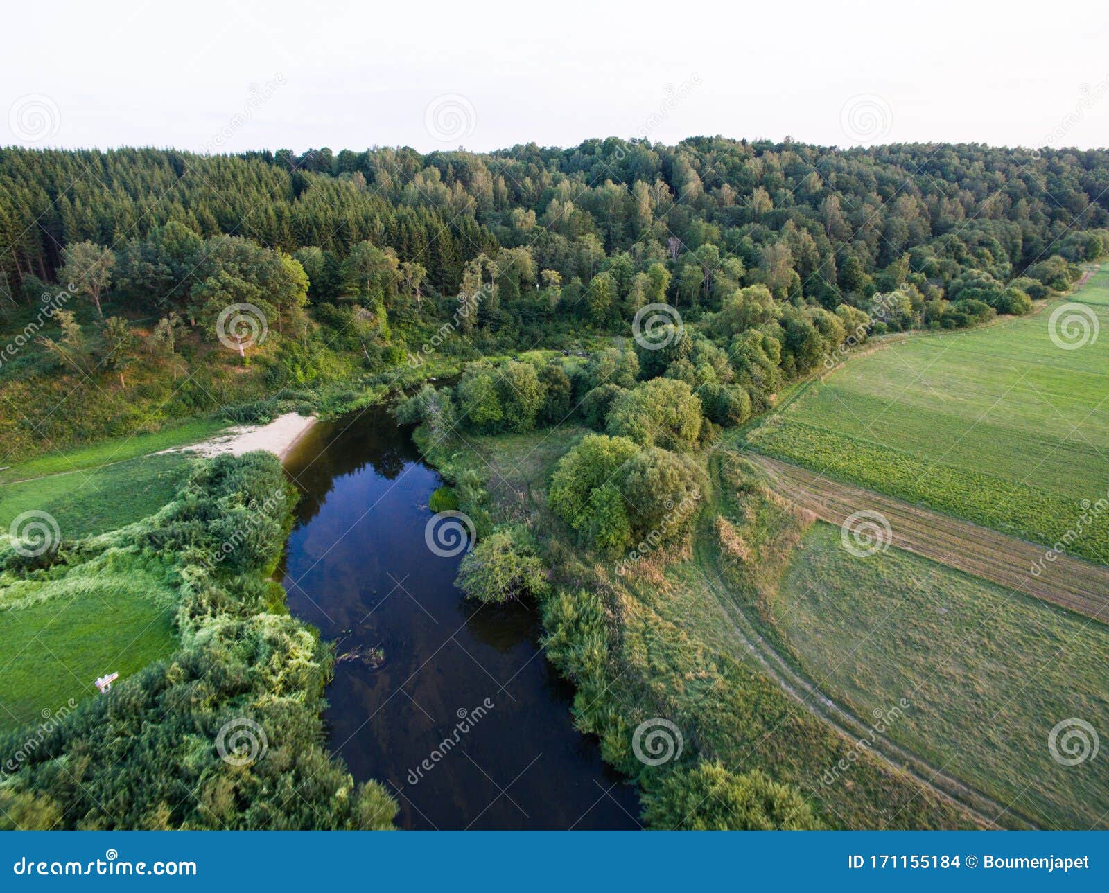 A Beautiful Sunny View of the Forest, Fields and River from Above with ...
