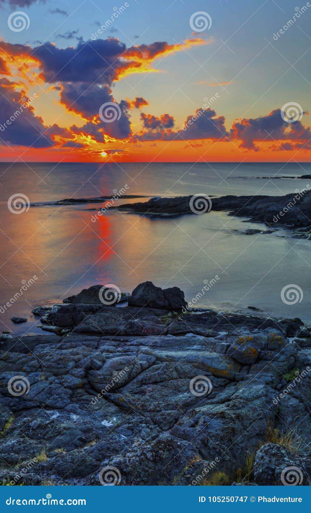 Sunrise on Rocky Shore and Dramatic Sky Clouds Stock Image - Image of ...